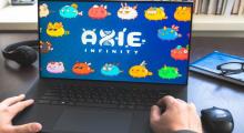 Axie Infinity diminui recompensas para jogadores, AXS dispara